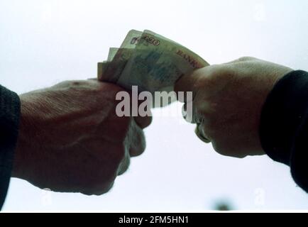Money being handed over Stock Photo - Alamy