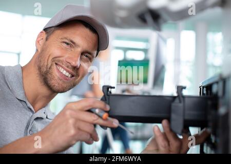 happy man fixing a printer Stock Photo - Alamy