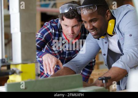 Machine cutting pvc profile. Production of PVC windows, a section of ...