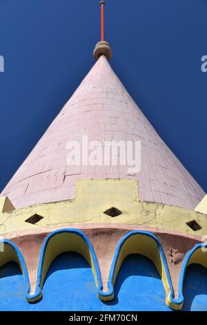 Yellow building with turret shaped tower and terrace and the Bosporus ...