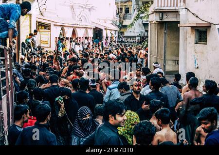 Shiite Muslims people using chains and blades during a ritual self ...