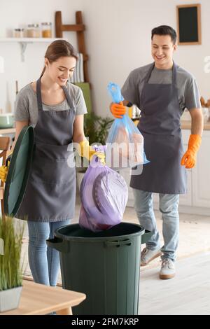 Janitor throwing garbage in bin at home Stock Photo - Alamy