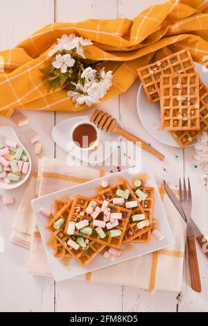 Waffles with colourful marshmallow Stock Photo - Alamy