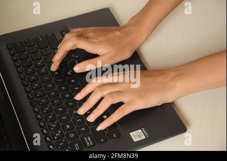 Girls hands on laptop keyboard, close up shot Stock Photo - Alamy