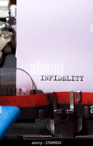 Infidelity word written with a typewriter Stock Photo - Alamy