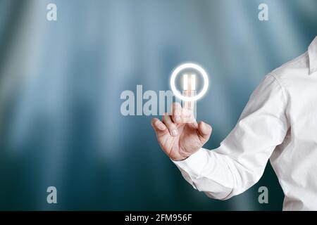 Pause - Hand pressing a button on blurred background concept . Business ...