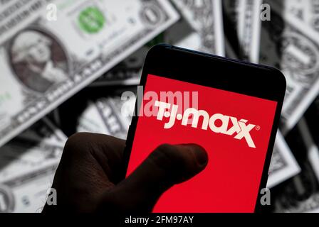 In this photo illustration, T.J. Maxx logo seen displayed on a tablet ...