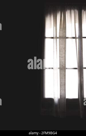 Lights shining through the window of a house at night Stock Photo - Alamy