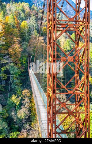 the suspension bridge over the Maé gorge in Igne, municipality of ...
