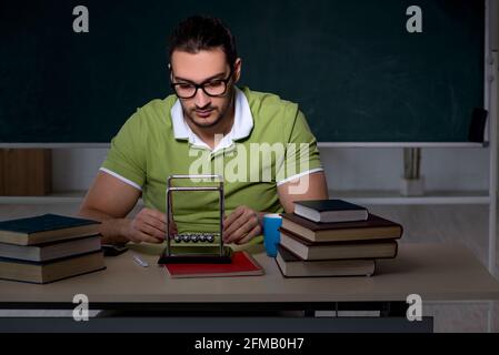 Male student physicist working hard at night time Stock Photo - Alamy