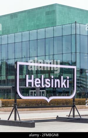 Helsinki sign with light with Helsinki Music centre in the background ...