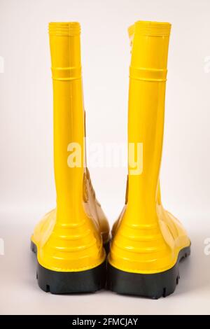 Robust and waterproof yellow rubber boots isolated on white background ...