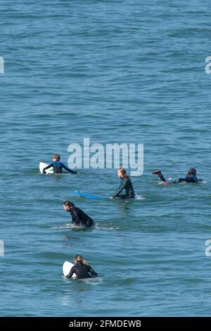 Surfers floating in the sea waiting for a wave off Gt Great Western ...