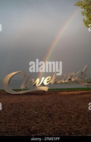 Cleveland script sign with rainbow from edgewater park with cityscape ...