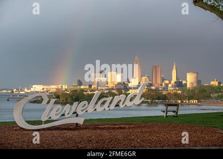 Cleveland script sign with rainbow from edgewater park with cityscape ...