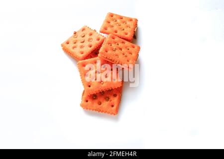 Orange crackers with filling on orange background Stock Photo - Alamy
