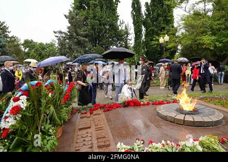 People lay flowers during the marking the 80th anniversary of the end ...