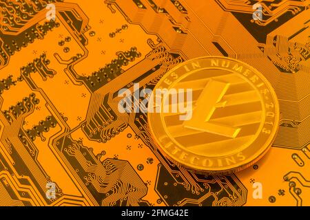 Litecoin and virtual money concept. Gold bitcoins with chart of growing ...