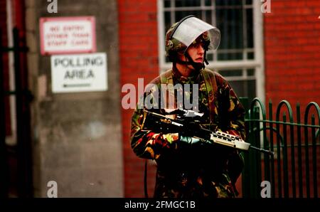 Police guard a polling station during the runoff presidential election ...