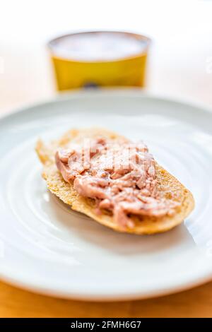 Cod liver Spread with oil in a skillet. Isolated, white background ...