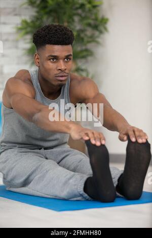 Male doing hamstring stretch Stock Photo - Alamy