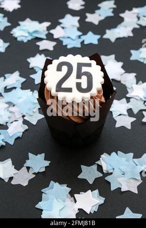 Number 25 on Delicious chocolate cupcake with cream on dark background ...