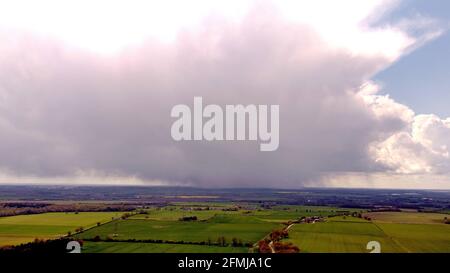 Peterborough, UK. 06th May, 2021. Heavy rain in menacing storm clouds ...