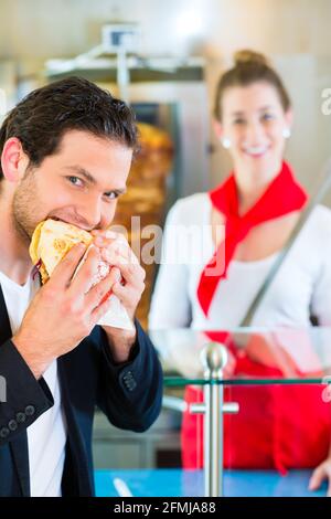Doner kebab - friendly vendor and customer in a Turkish fast food ...