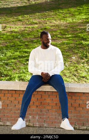 Photo of cheerful happy afro american man point finger sweater ...