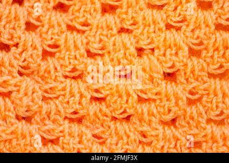 The texture of a knitted sweater wallpaper. Woolen fabric for wallpaper ...