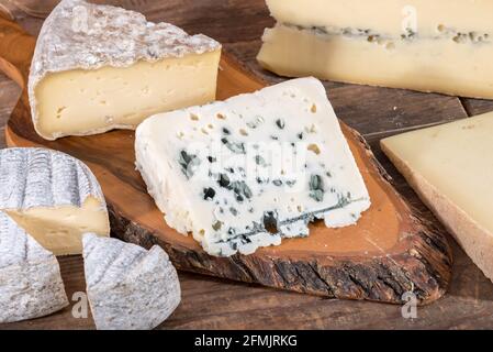 Composition with different varieties of French cheeses Stock Photo - Alamy