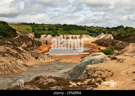 Abandoned copper mine and tailings lagoon at Wheal Maid Valley, St. Day ...