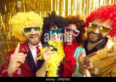 Funny happy overjoyed group of people friends having fun in nature on ...