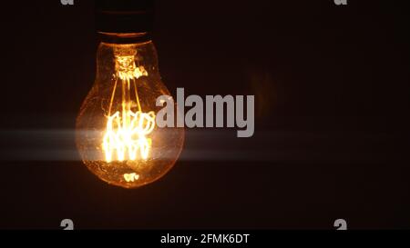 Vintage Edison light bulb reproduction on blue background Stock Photo ...