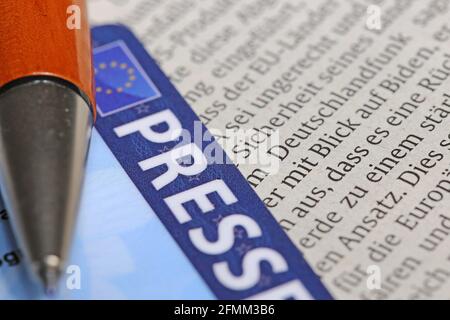 Press card, ballpoint and newspaper article as a symbol for the press ...