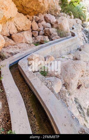 Falaj (irrigation system) in date palm grove, Hatta Heritage Village ...