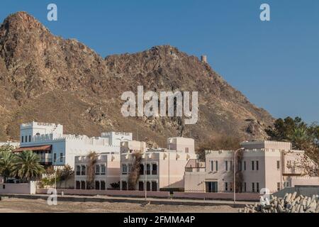 Buildings on a coast in Muscat, Oman Stock Photo - Alamy