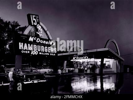 A photograph of a classic 1950s McDonald's fast food drive-in ...