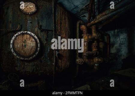 Old rusty vat and pipes in underground basement Stock Photo - Alamy