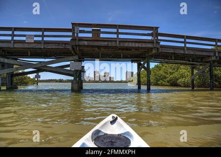 Bridge leading to the ocean of Clam Pass from a kayak in Naples ...