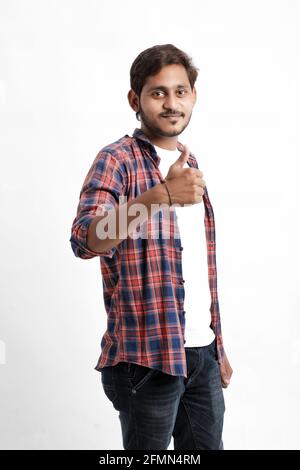 Collage of attractive young man over white isolated background pointing ...