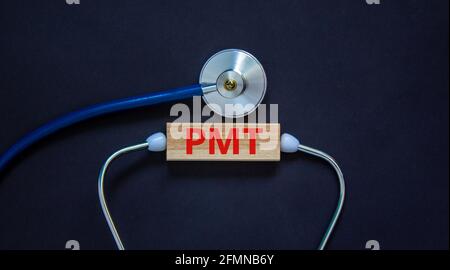 Medical and PMT, premenstrual tension symbol. Wooden cubes and blocks ...