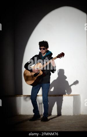 Acoustic guitar with teenager hands Stock Photo - Alamy