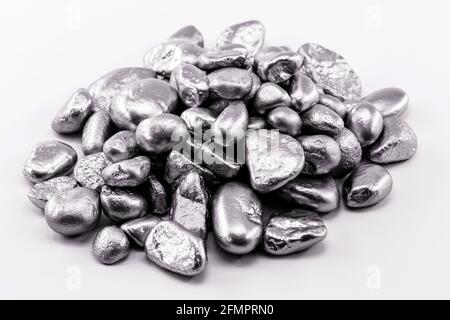 various rough silver nuggets on black background, texture of silvery ...