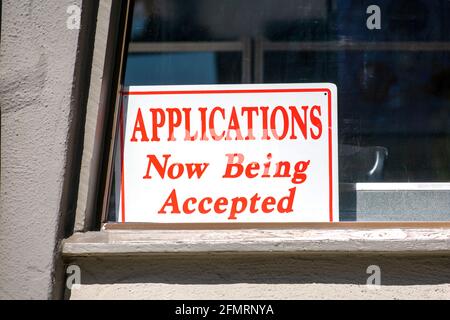 Advertisement for a job vacancy in a shop window Stock Photo - Alamy