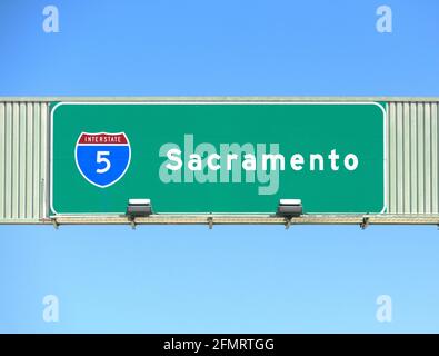 California highway 1. Green sign on the street against blue sky ...