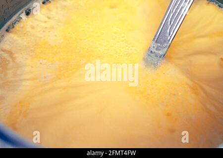 The cream layer formed on the cooked milk Stock Photo - Alamy