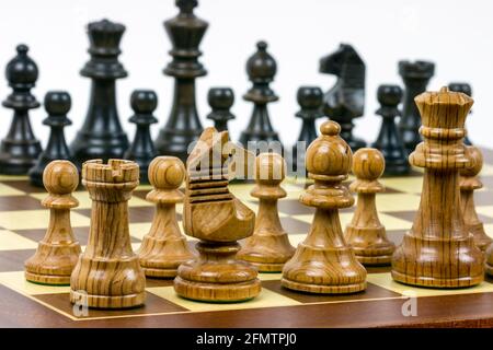 Set of chess figures on the playing board Stock Photo - Alamy