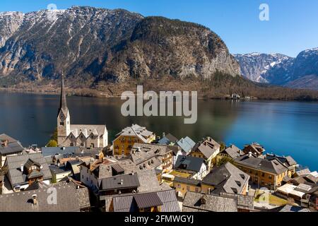 Hallstatt, Austria - March 31, 2021 View of Hallstatt with snow-capped ...