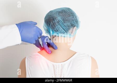 Doctor makes injection medical blockade of hormonal drugs of ...